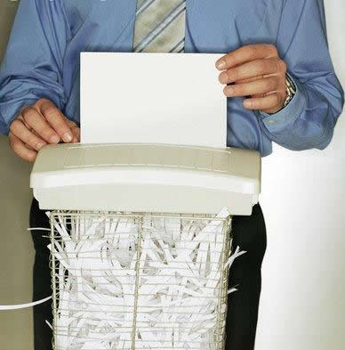 Person Shredding Paper