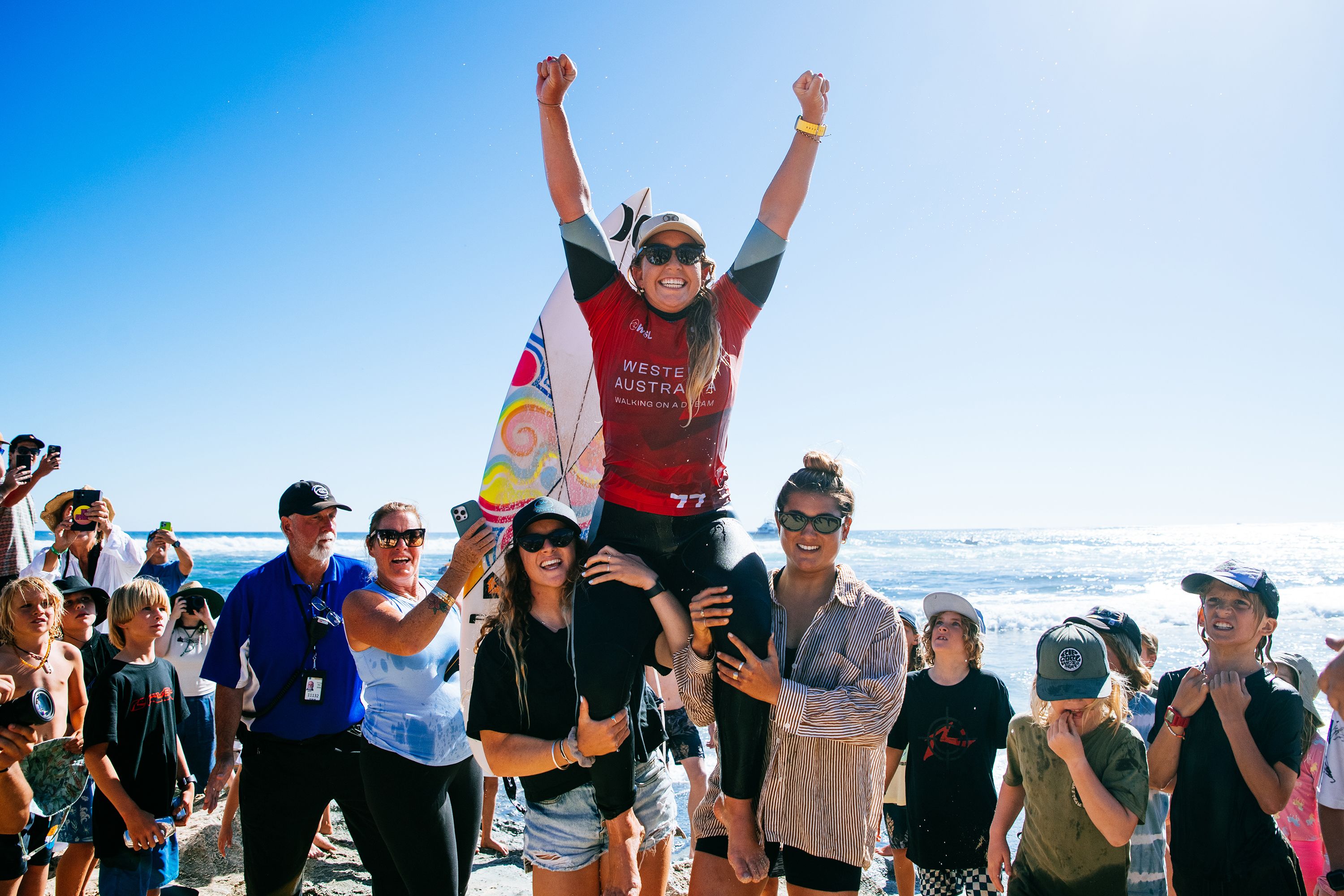 ‘Magical’ moment as surfer shares wave with pod of dolphins as she wins ...